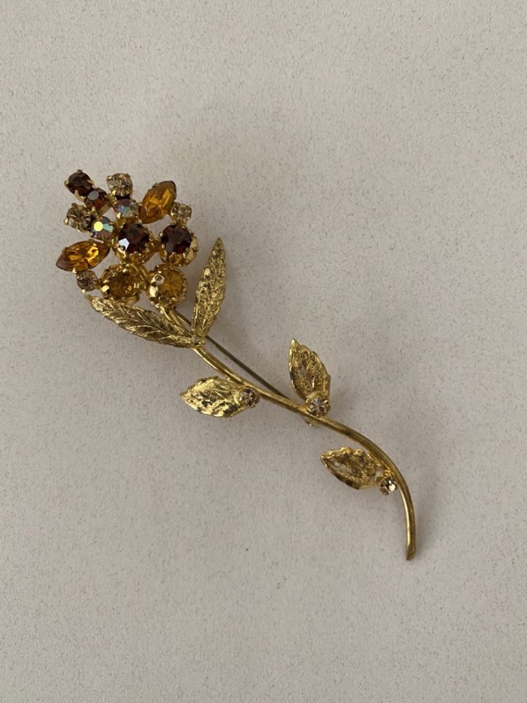 Long Gold Flower with Topaz Colored Stones – World Sensorium / Conservancy